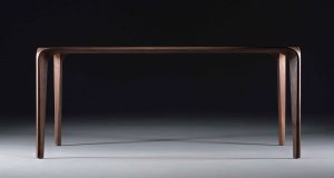 Each leg is seamlessly attached to the tabletop. The smooth curve and ...